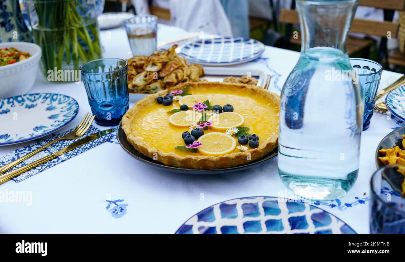 Lemon tart on a beautifully decorated Delft style table Stock Photo - Alamy