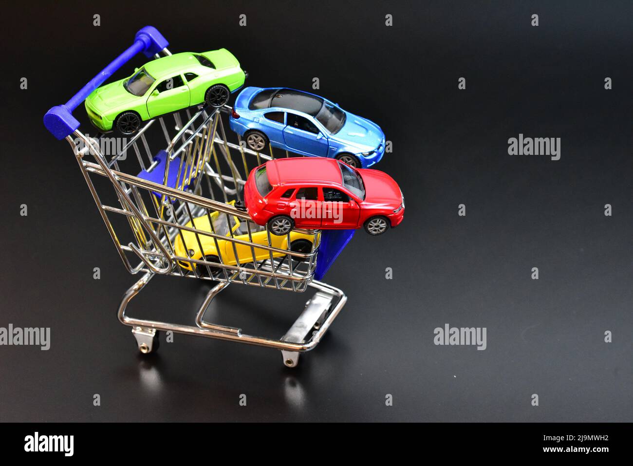shopping cart with toy cars Stock Photo - Alamy