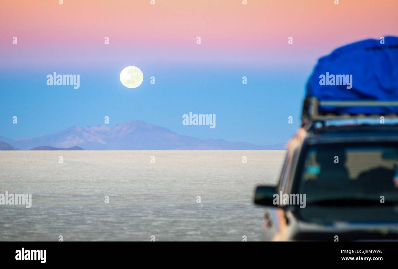 Full moon sunset with off road jeep vehicle on Salar De Uyuni - World ...