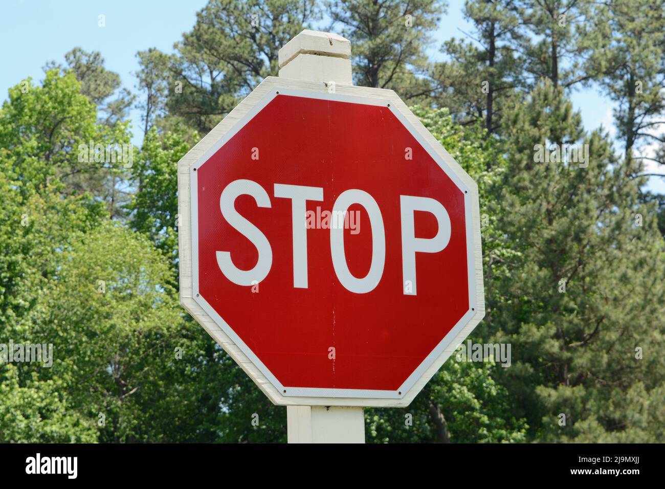Just a framed, suburban stop sign, directing traffic Stock Photo - Alamy