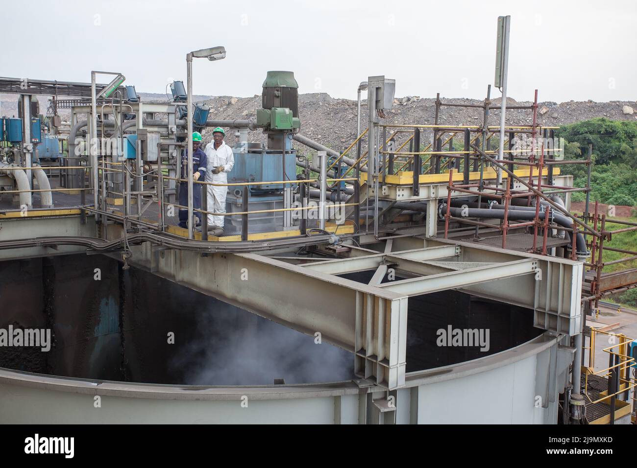 Two mine employees above a Froth Flotation Tank Stock Photo - Alamy