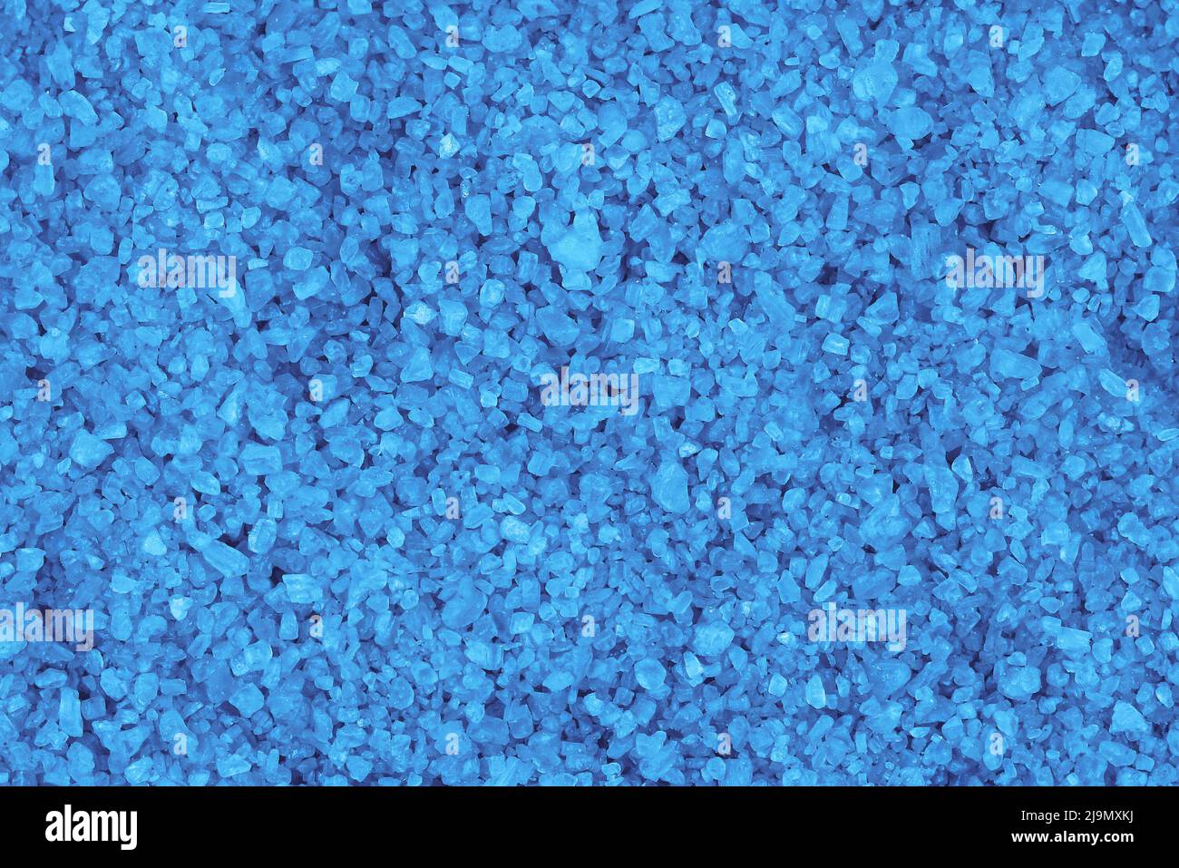 Blue mineral bath salt top view background Stock Photo - Alamy