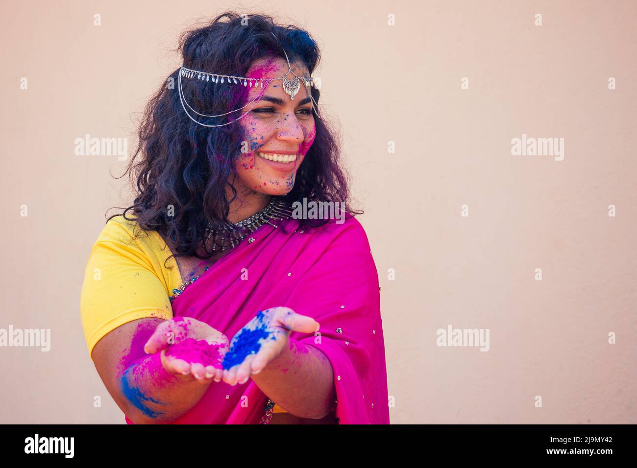Holi Festival Of Colours. Portrait of happy indian girl in traditional ...