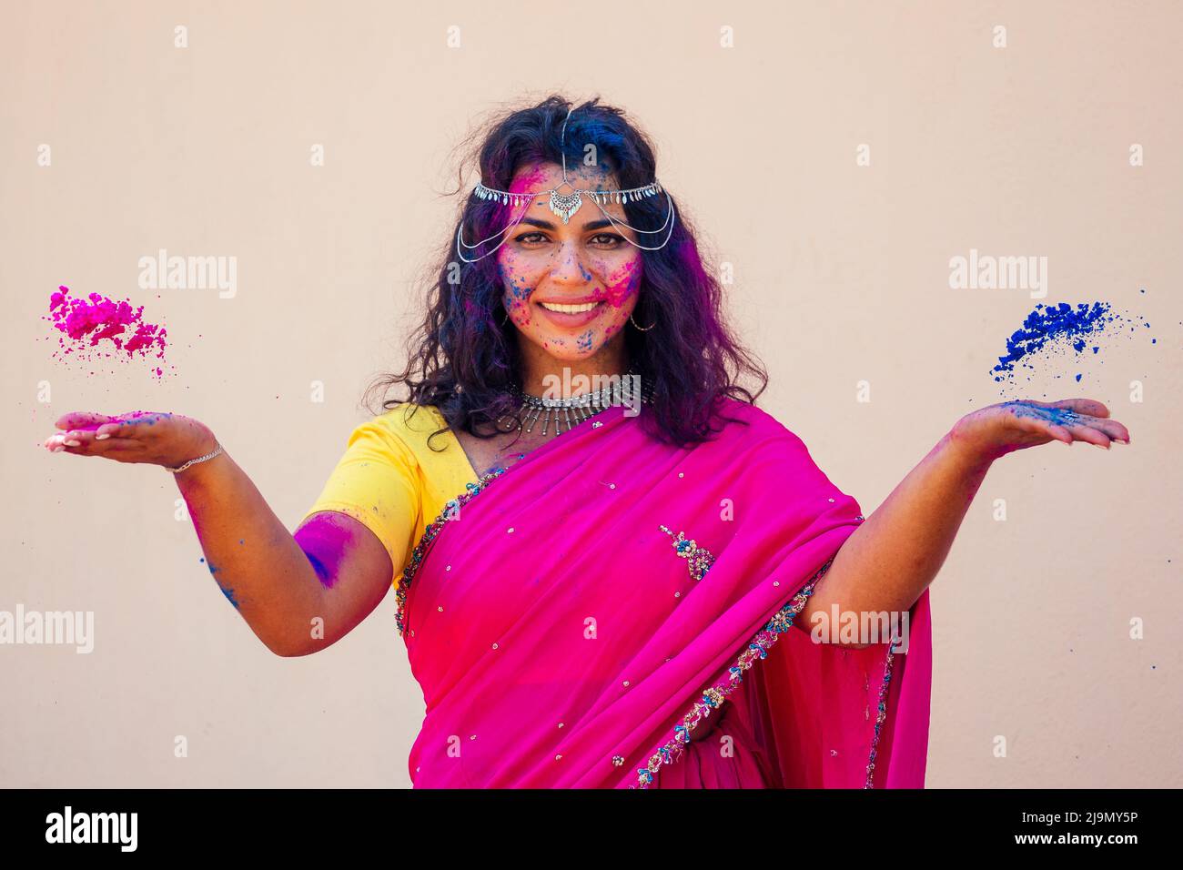 Holi Festival Of Colours. Portrait of happy indian girl in traditional ...