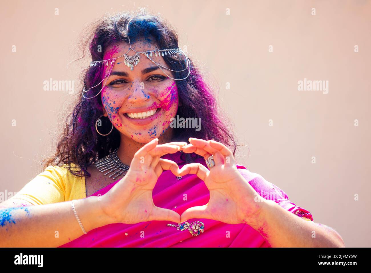 Holi Festival Of Colours. Portrait of happy indian girl in traditional ...
