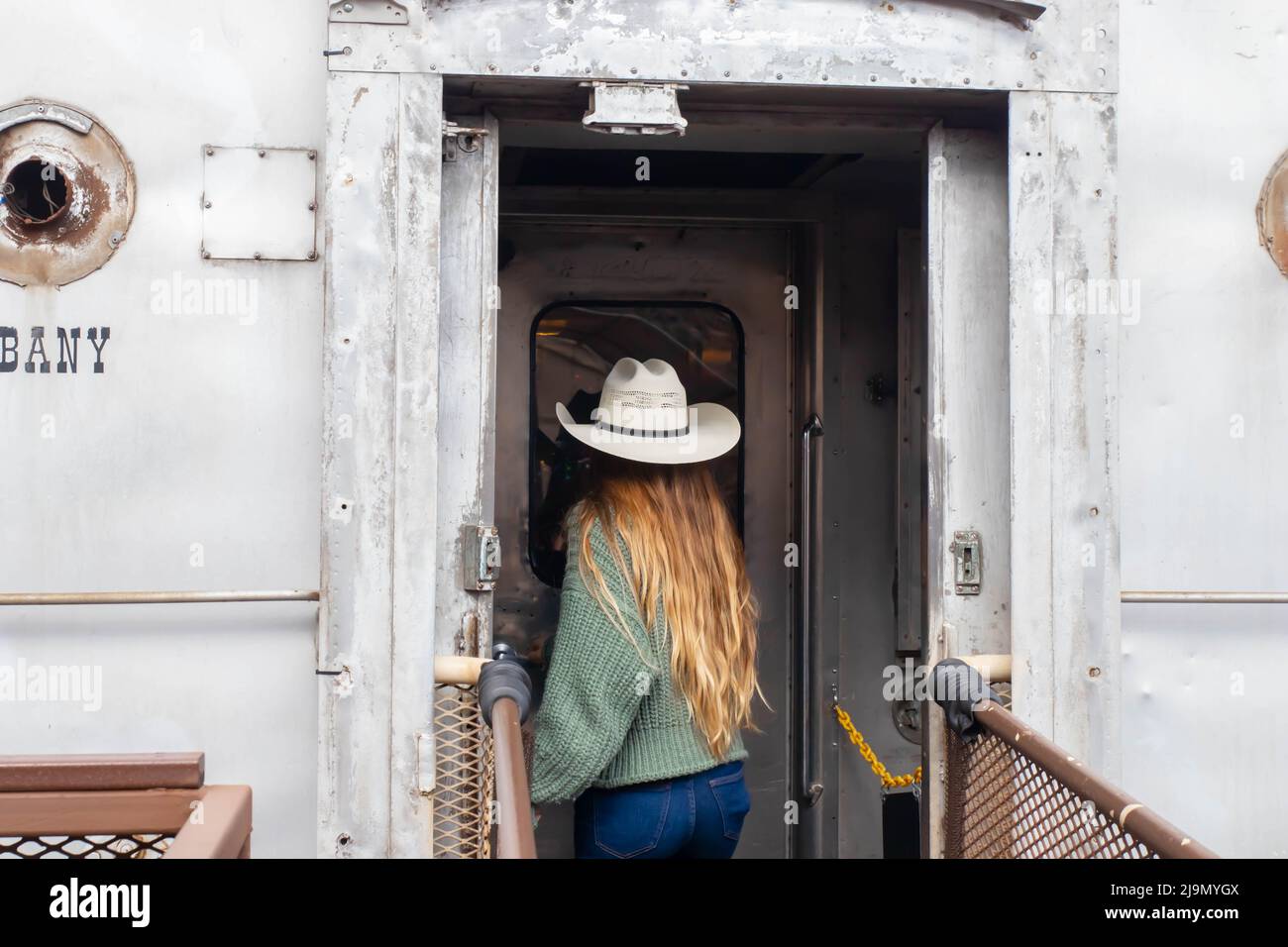 Passenger with cowboy hat entering on Arizona train Stock Photo - Alamy