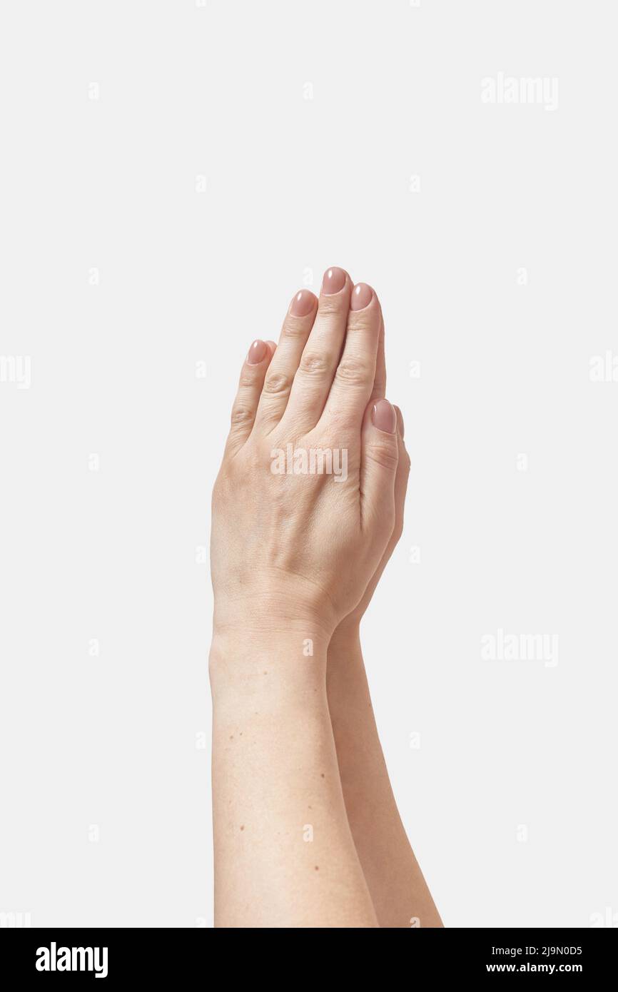 Two hands pray gesture isolated on white Stock Photo - Alamy