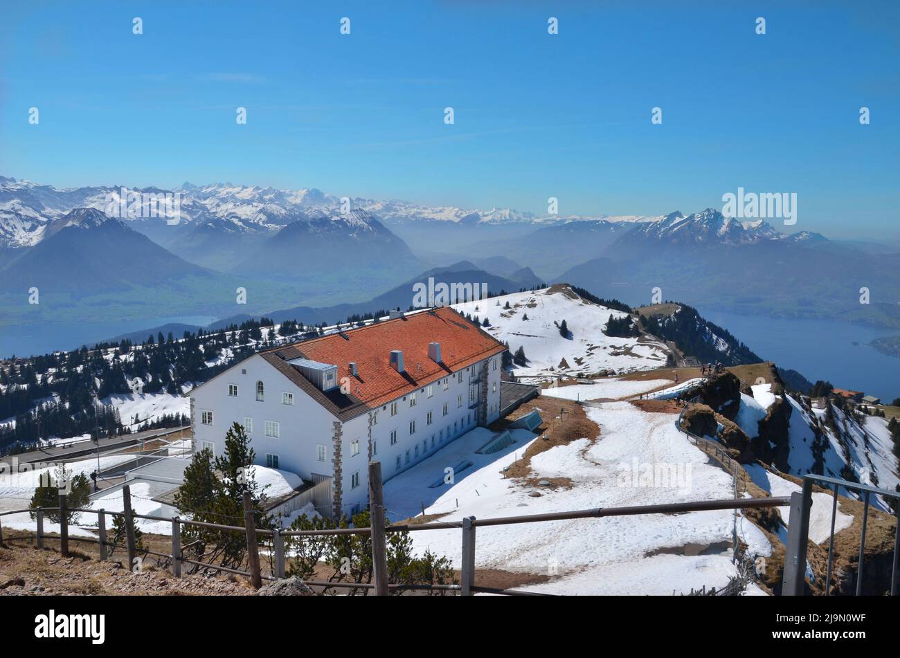 A wooden cottage hut at the top of rigi mountains surrounded by white ...