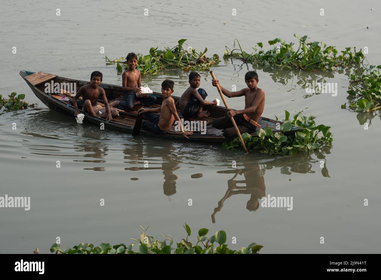 Dhaka, Dhaka, Bangladesh. 24th May, 2022. Boys are seen boating in the Buriganga river in Dhaka ...