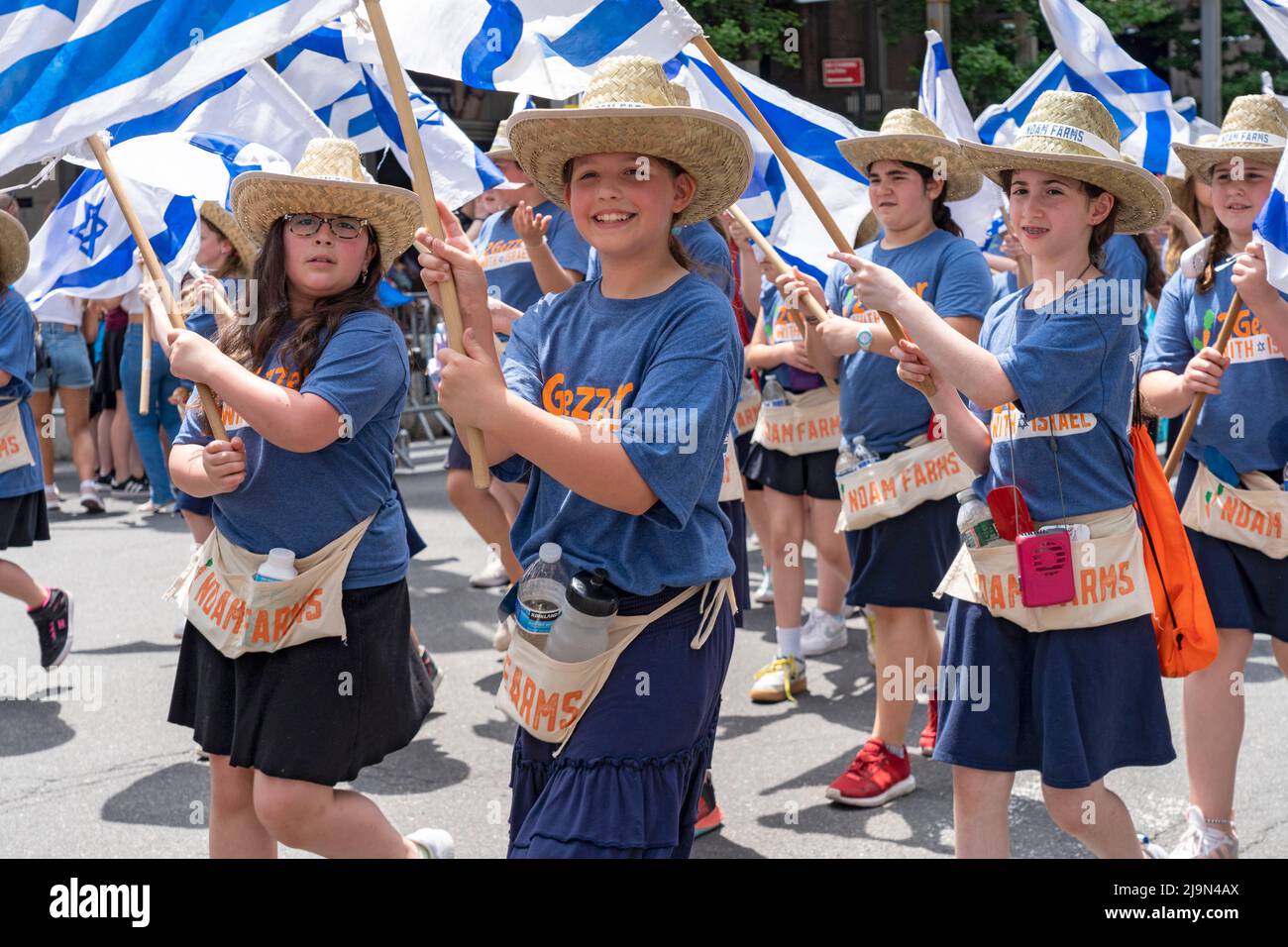 Participants holding Israeli flags march along Fifth Avenue during the ...