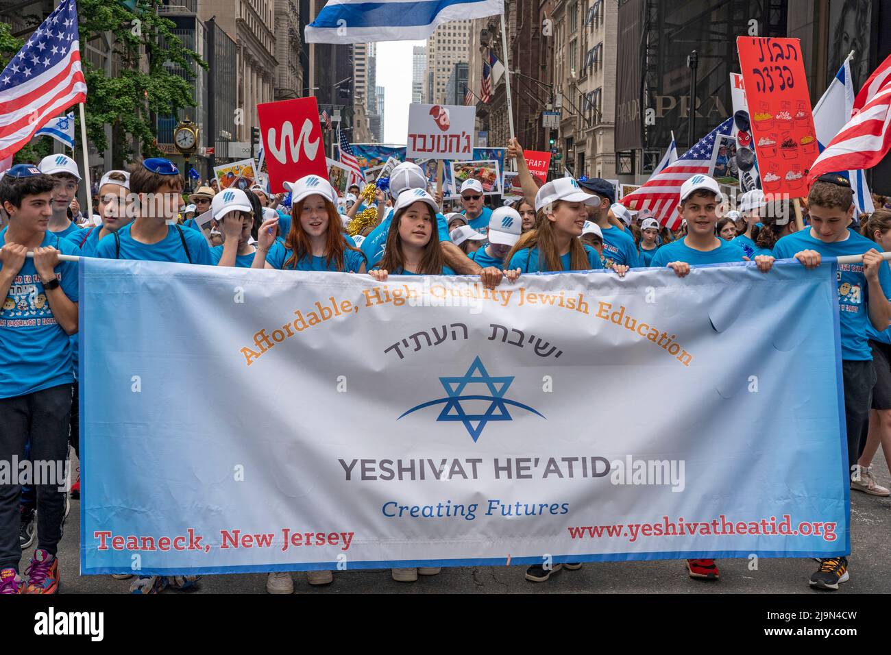 Participants holding a banner march along Fifth Avenue during the ...