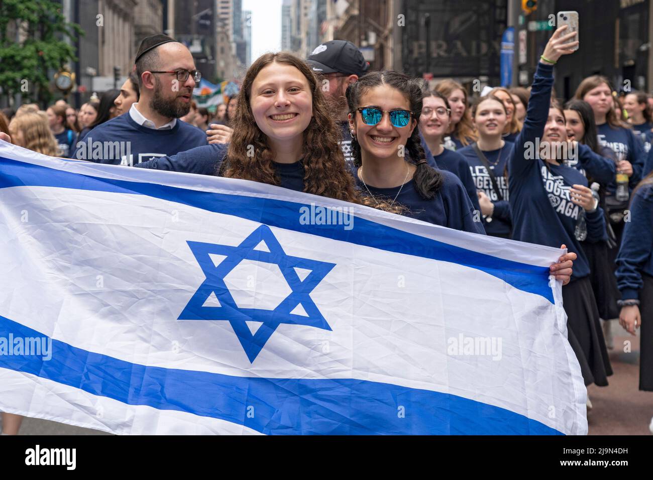 Participants holding Israeli flag march along Fifth Avenue during the ...