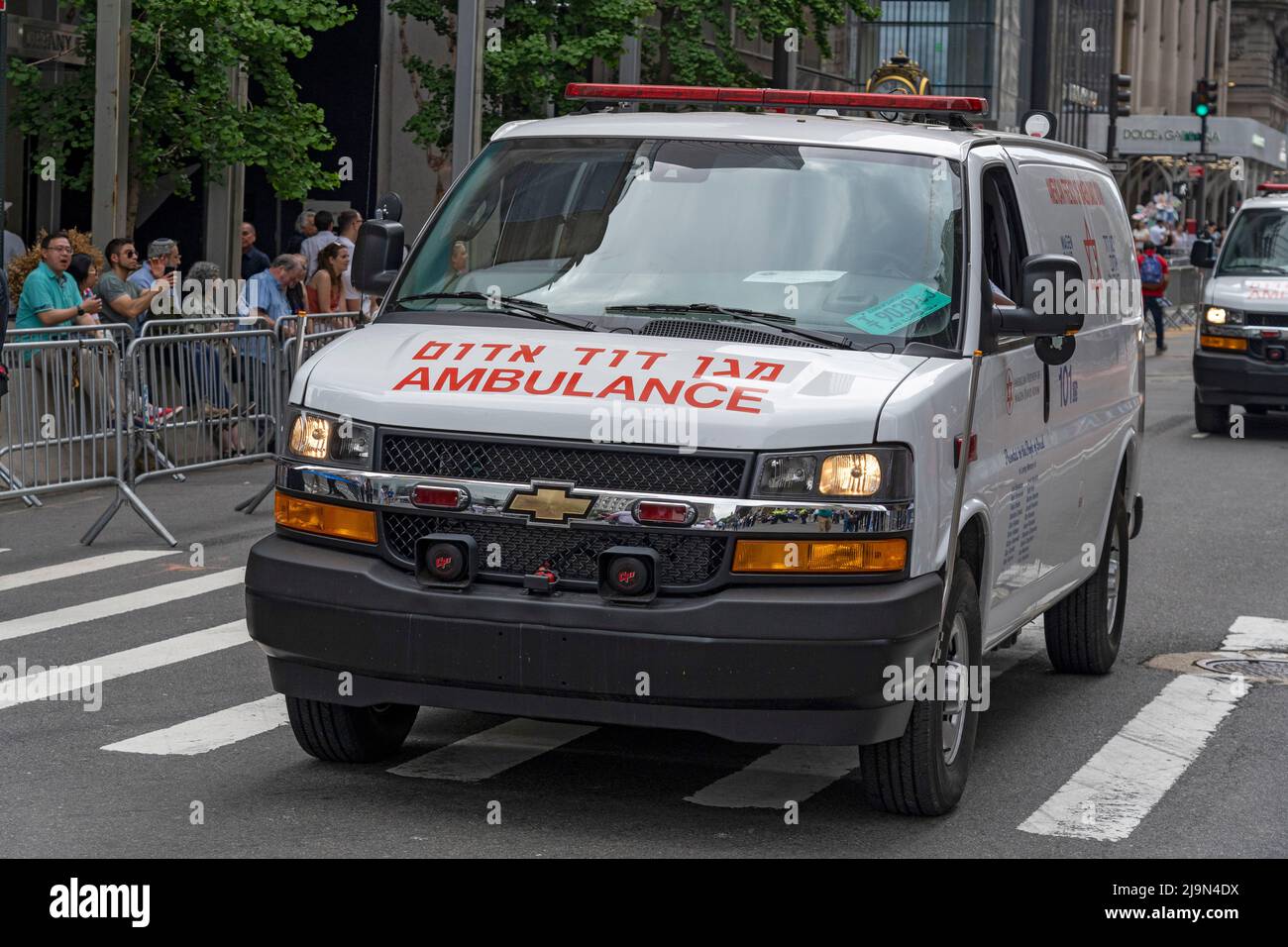 A simulation of an Israeli ambulance drives up Fifth Avenue during the ...