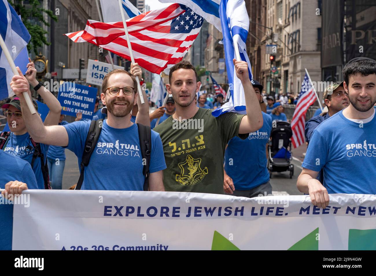 Participants holding Israeli flags march along Fifth Avenue during the ...