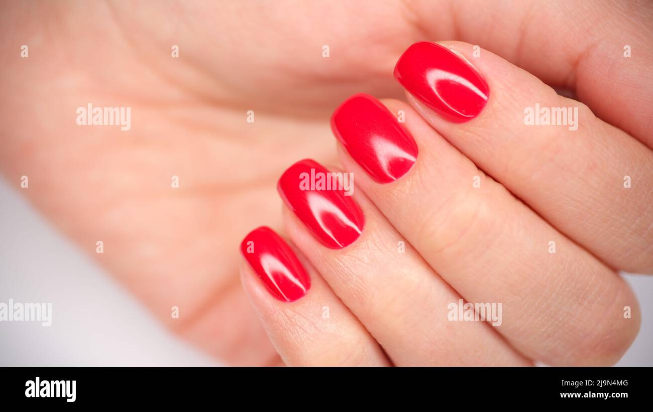 Female arm red nails hi-res stock photography and images - Alamy
