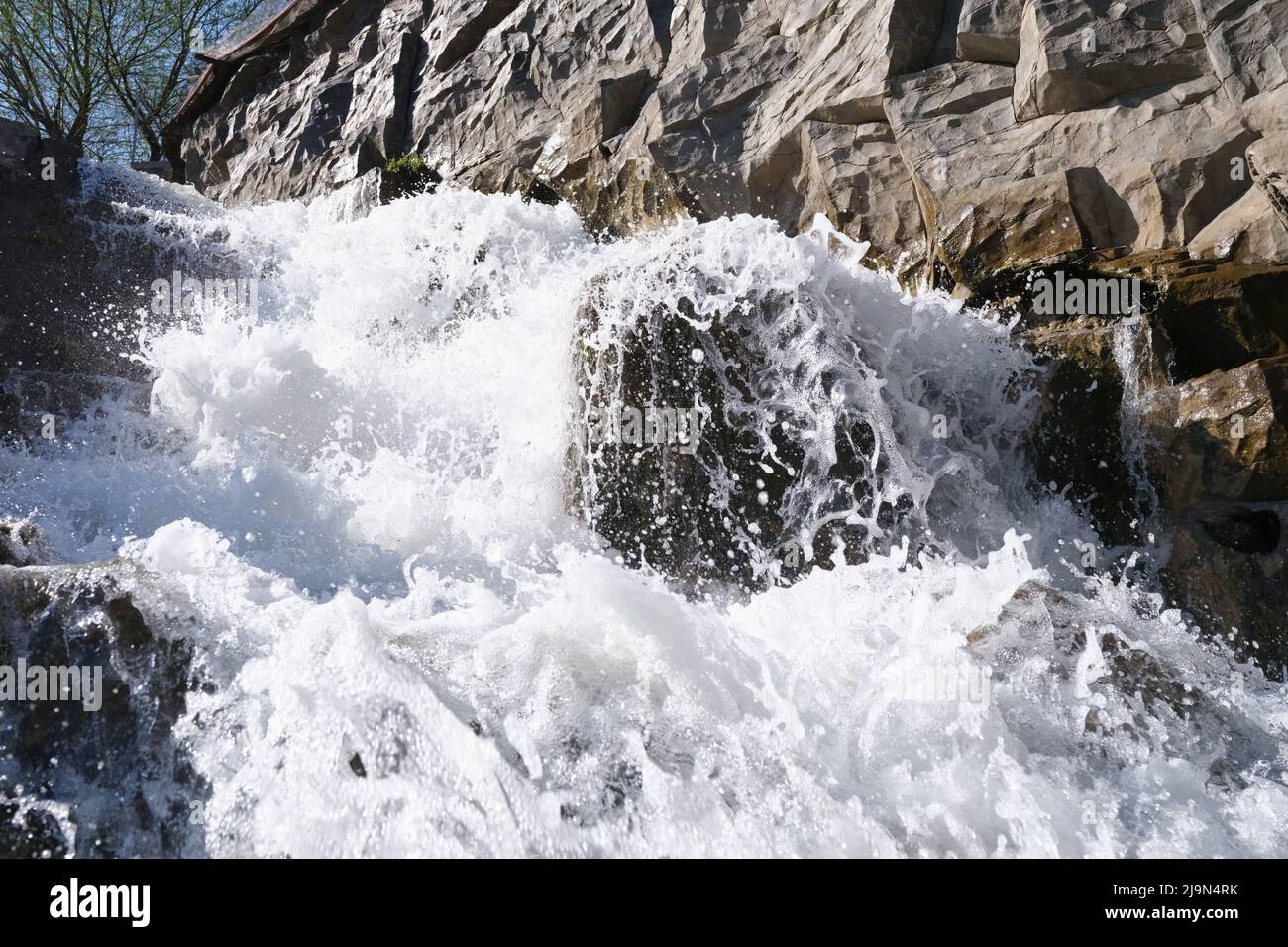 River flowing through rocks and stones closeup Stock Photo - Alamy