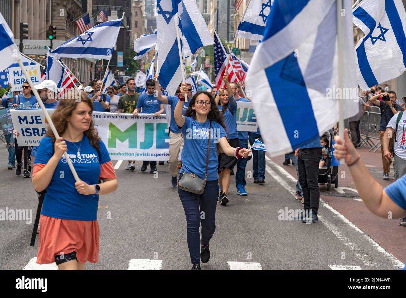 Participants holding Israeli flags march along Fifth Avenue during the ...