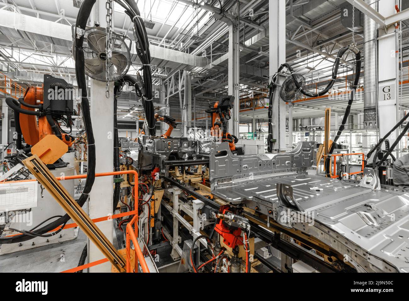 Photo of automobile production line. Welding car body. Modern car ...