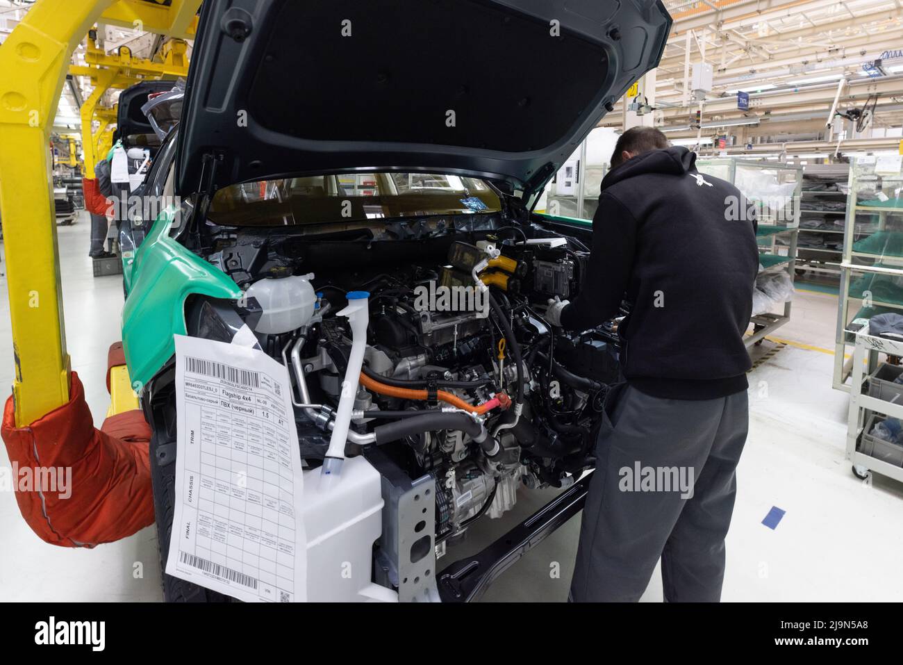Car bodies are on assembly line. Factory for production of cars. Modern ...