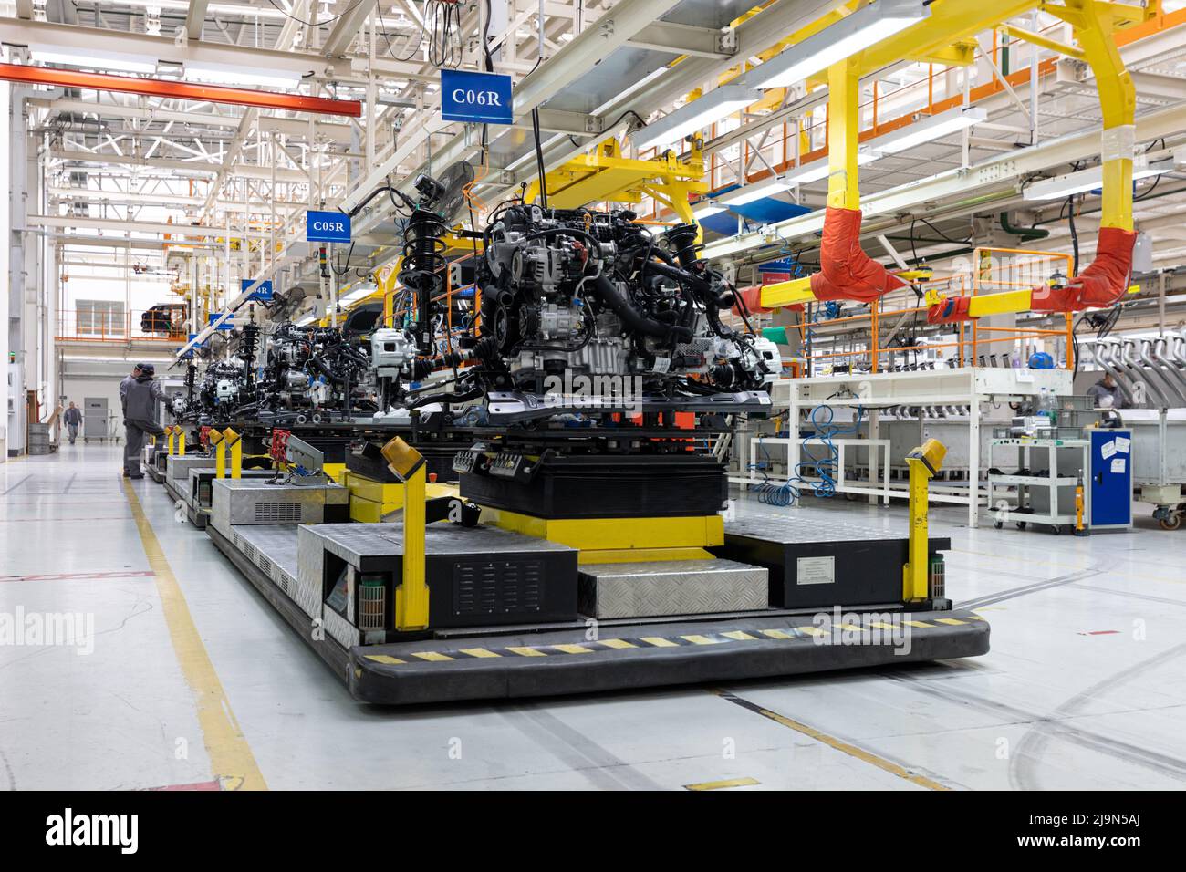 Photo of car bodies are on assembly line. Factory for production of ...