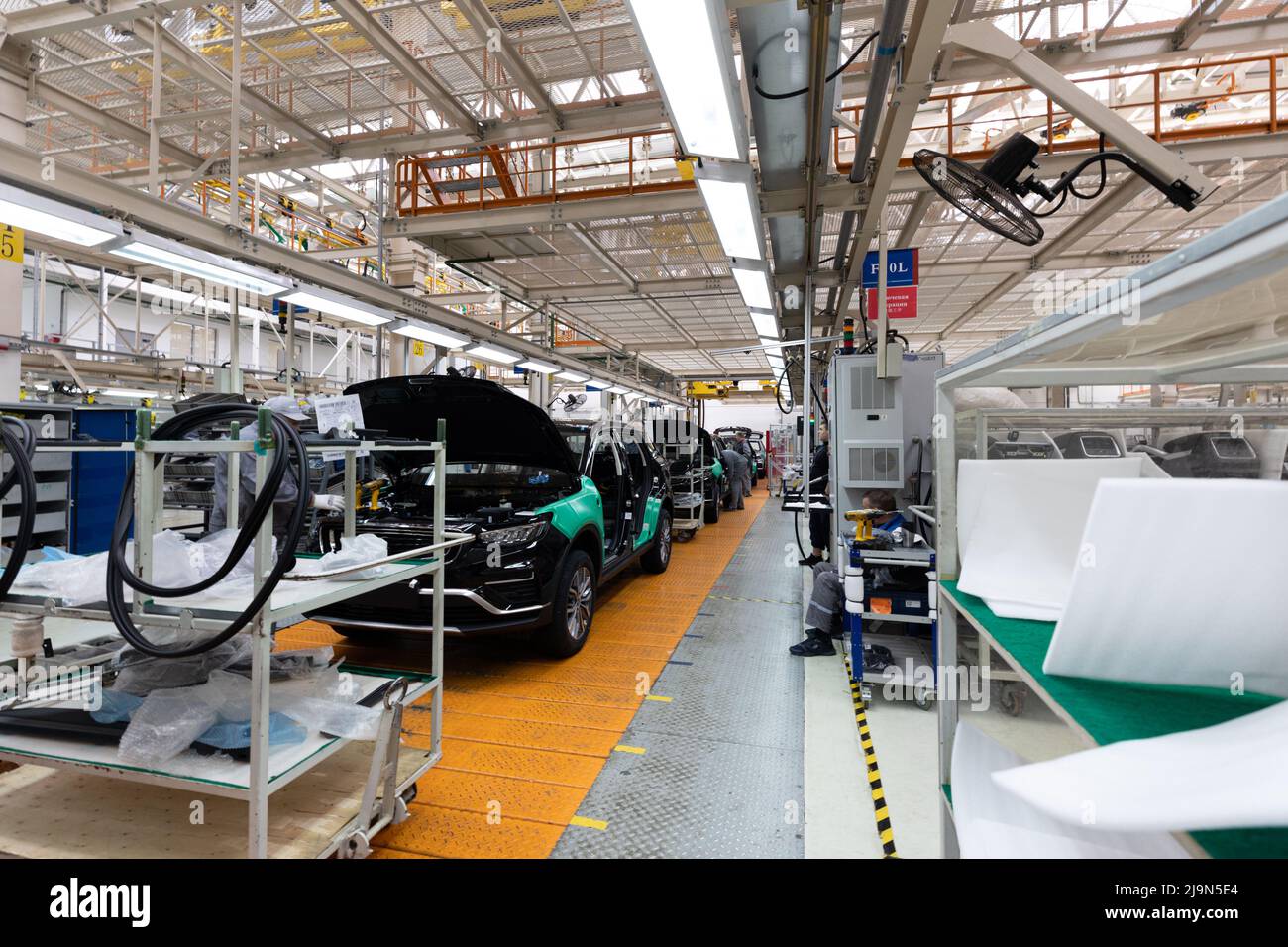 Car bodies are on assembly line. Factory for production of cars. Modern ...