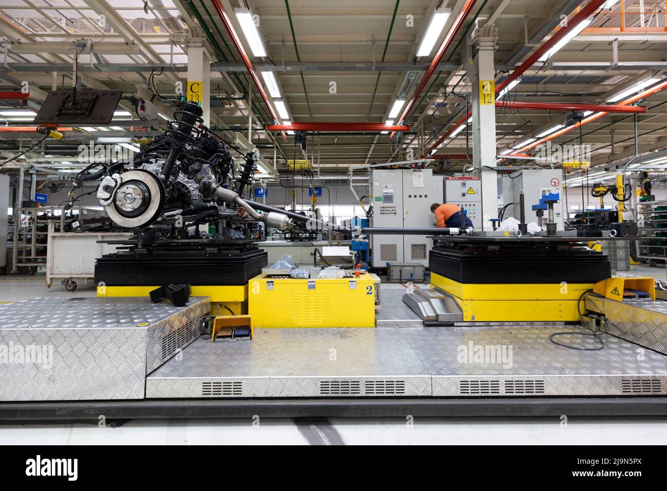 Car bodies are on assembly line. Factory for production of cars. Modern ...