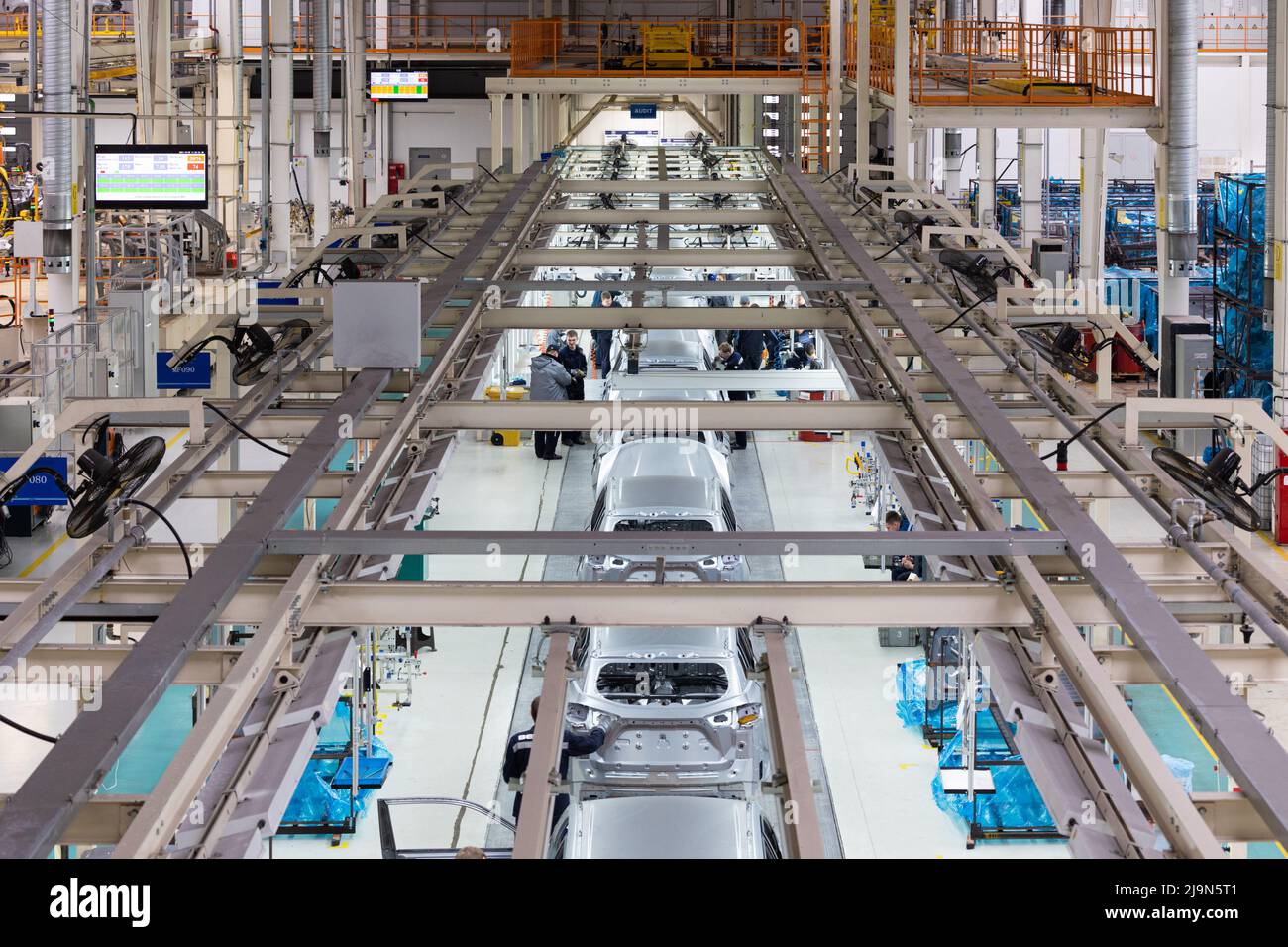 Photo of automobile production line. Modern car assembly plant. Modern ...