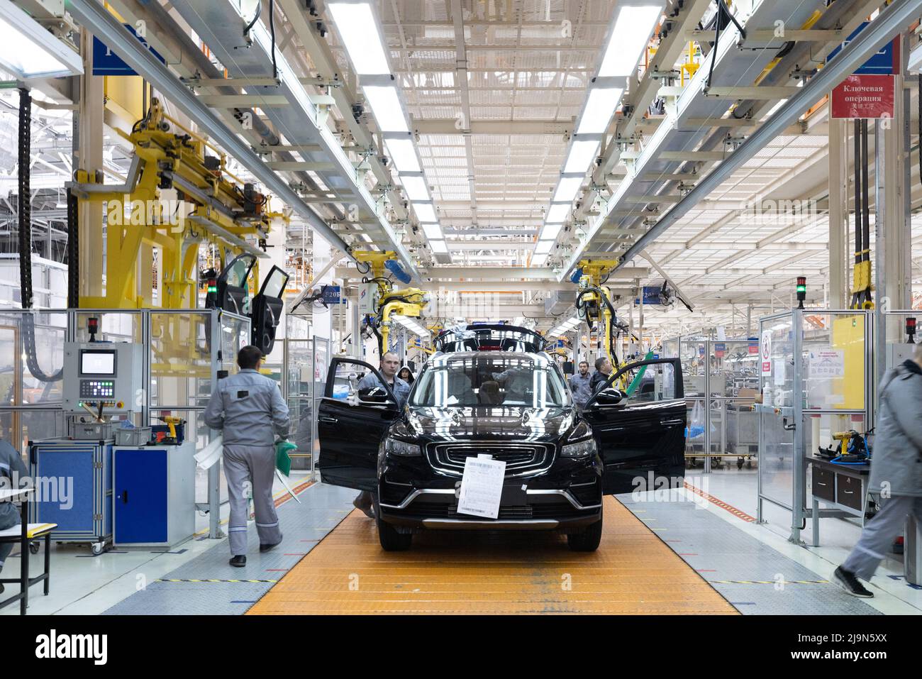 Car bodies are on assembly line. Factory for production of cars. Modern ...