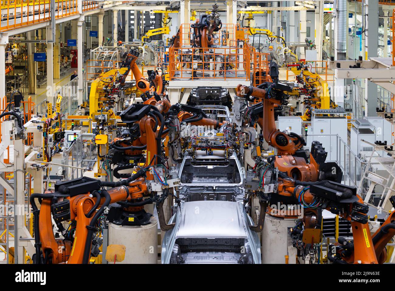 Photo of automobile production line. Modern car assembly plant. Modern ...
