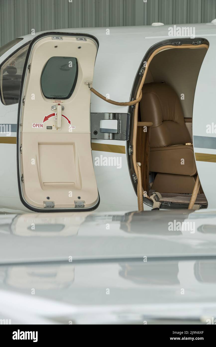 Stairs and door of a small private jet in hangar ready to fly- stock ...