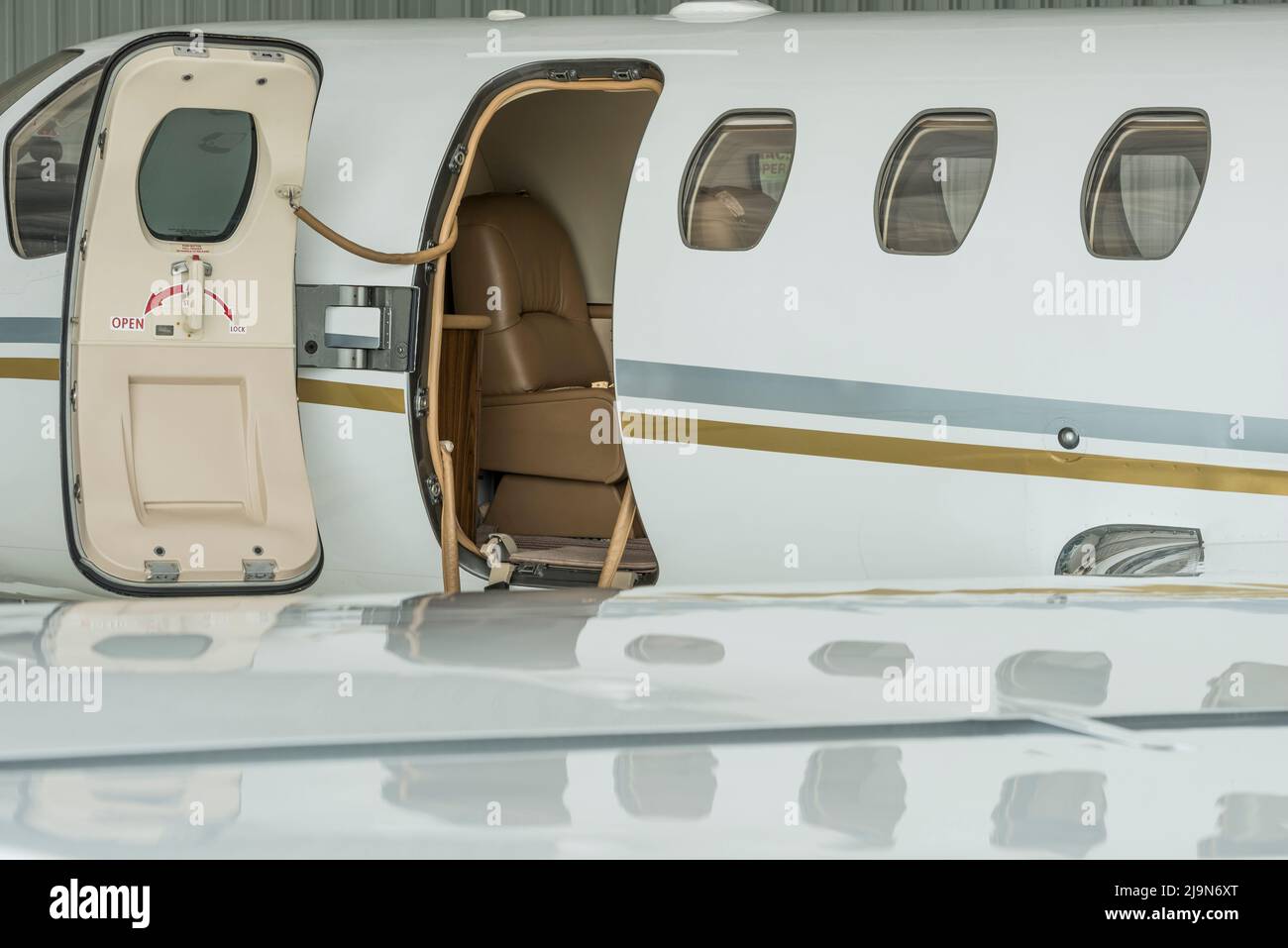 Stairs and door of a small private jet in hangar ready to fly- stock ...