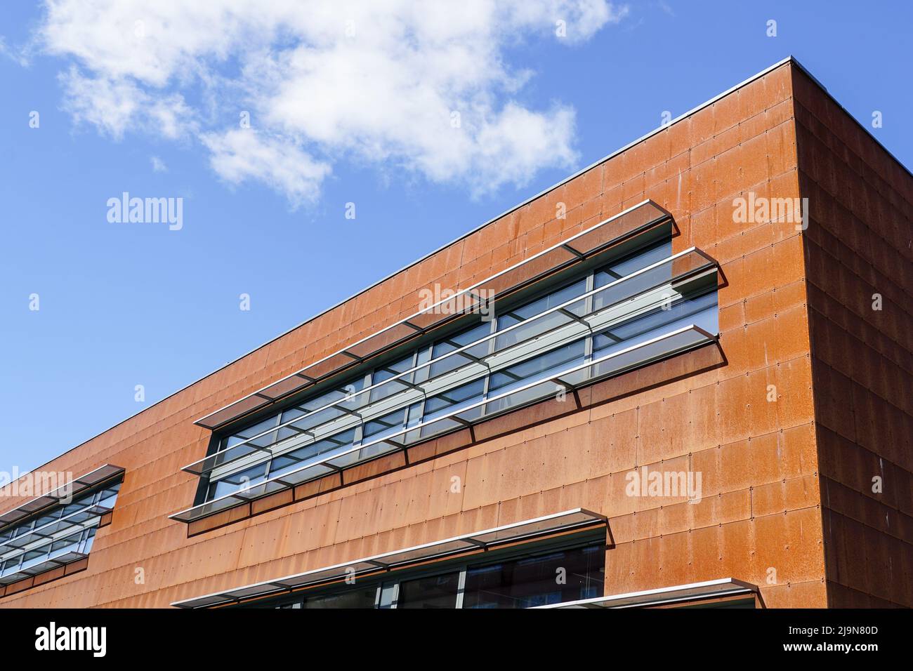 Rusted corten steel panels cladding facade of a modern design house on ...