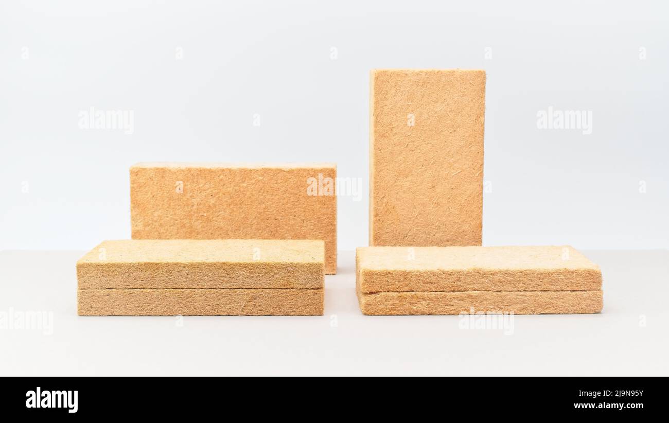 wooden fibers thermal insulation blocks on a white background - energy ...