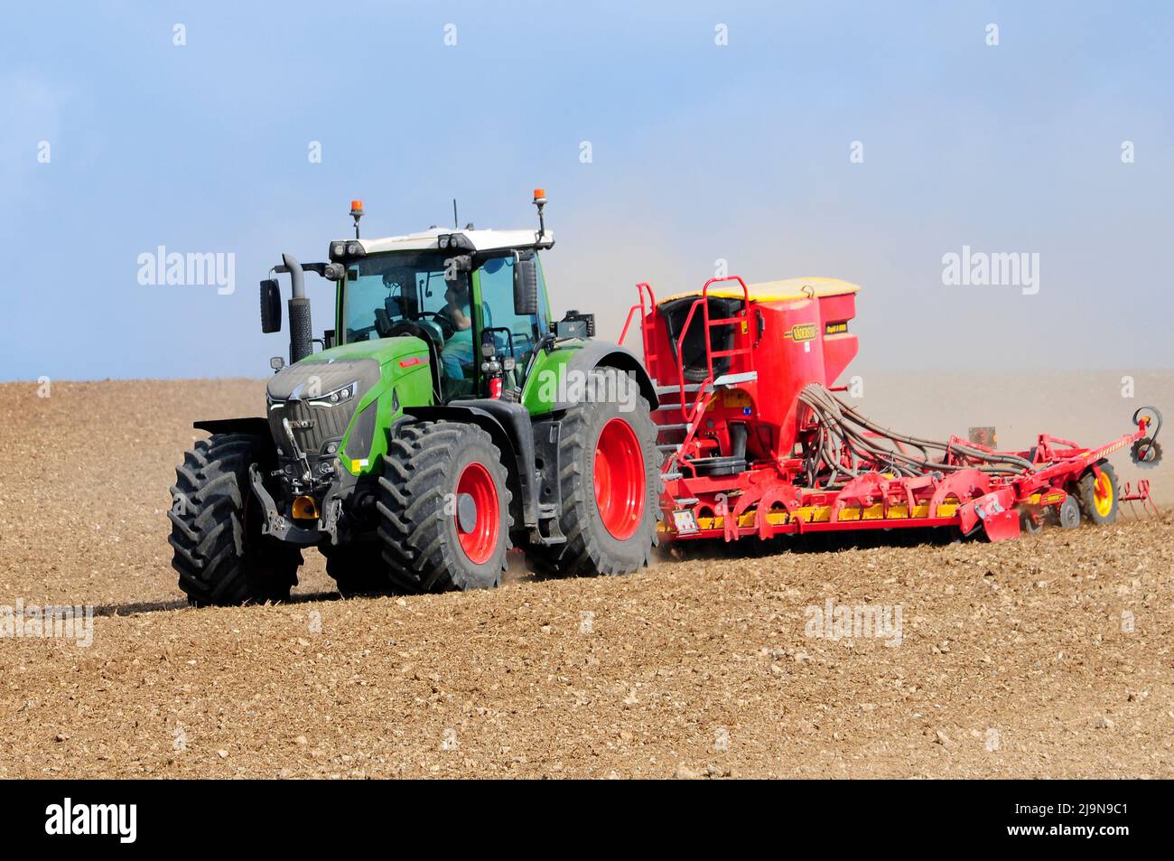 Tractor drilling seed on large arable field in Dorset, UK Stock Photo ...