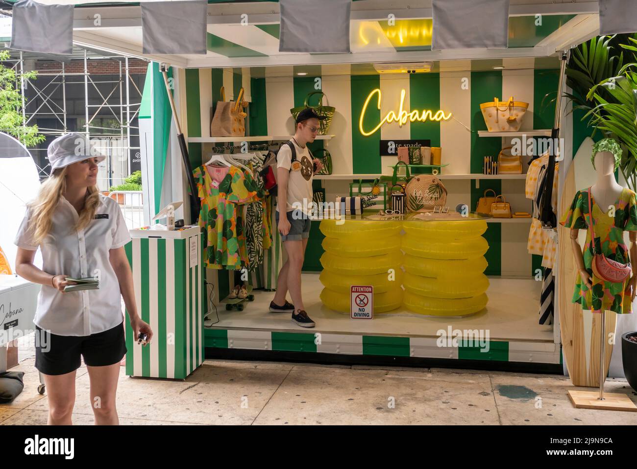 Visitors participate in the Kate Spade Cabana brand activation in the ...