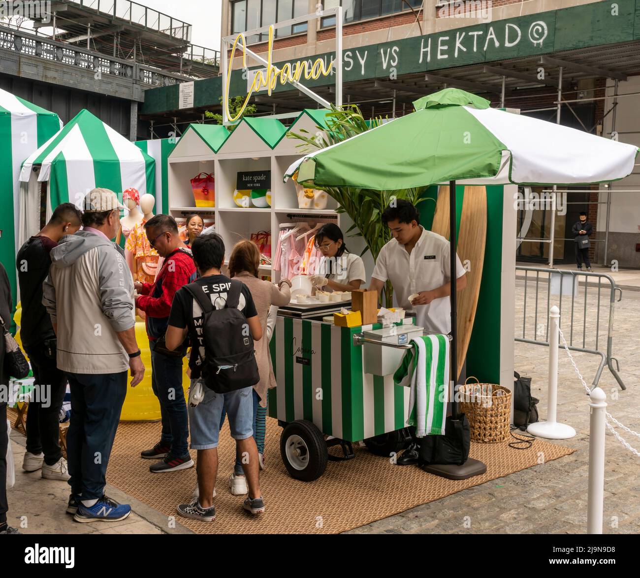Visitors participate in the Kate Spade Cabana brand activation in the ...