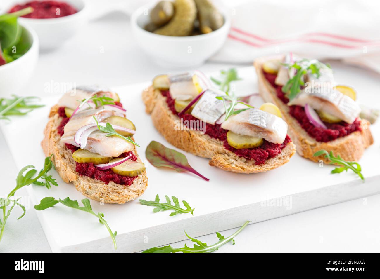 Sandwiches, toasts with salted herring and beetroot pate Stock Photo ...