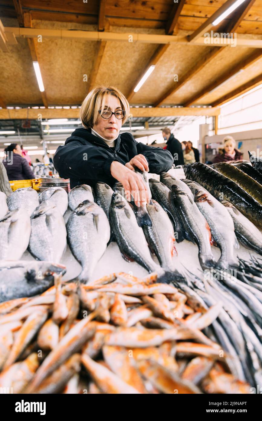 Batumi, Georgia. Woman selling fresh fish at fish market Stock Photo ...