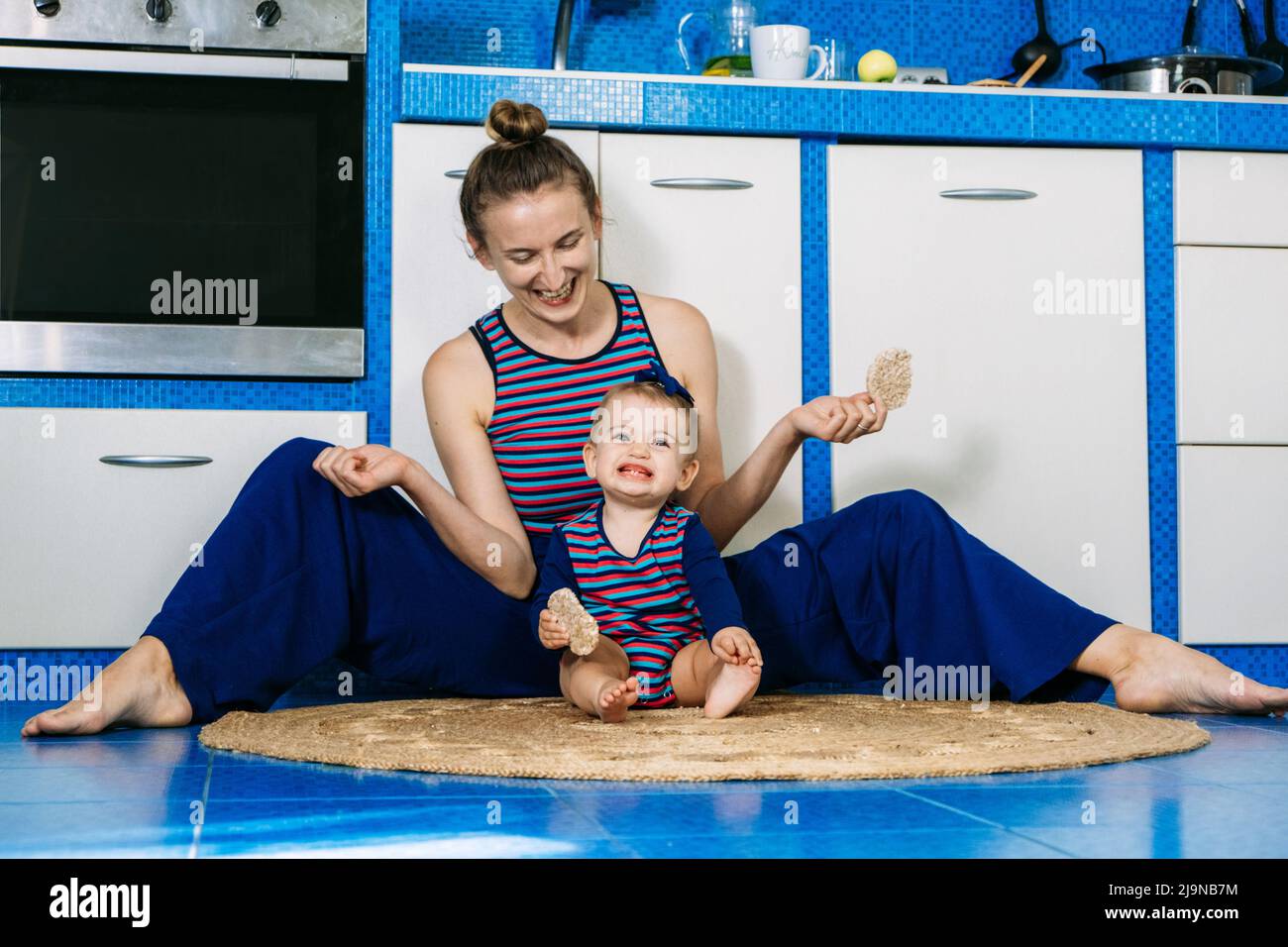 Healthy snacks for babies and toddlers. Happy loving family. Candid ...