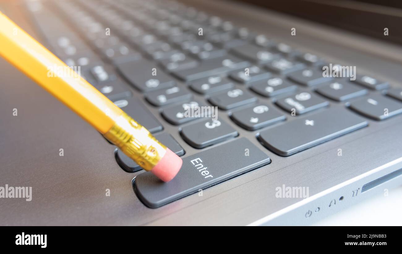 Pen by pressing the enter key on a computer keyboard Stock Photo - Alamy
