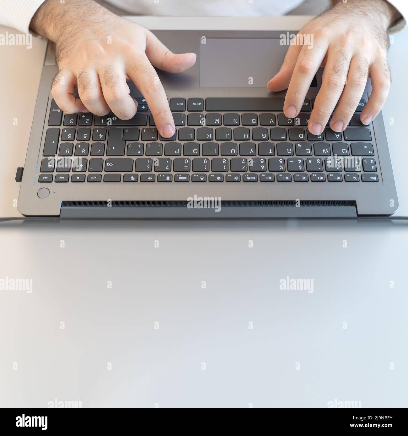 Hands of man typing a laptop, photo with copy space Stock Photo - Alamy