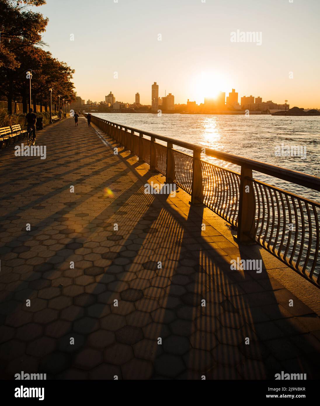 Walking path along the East River in Lower East Side Manhattan at ...