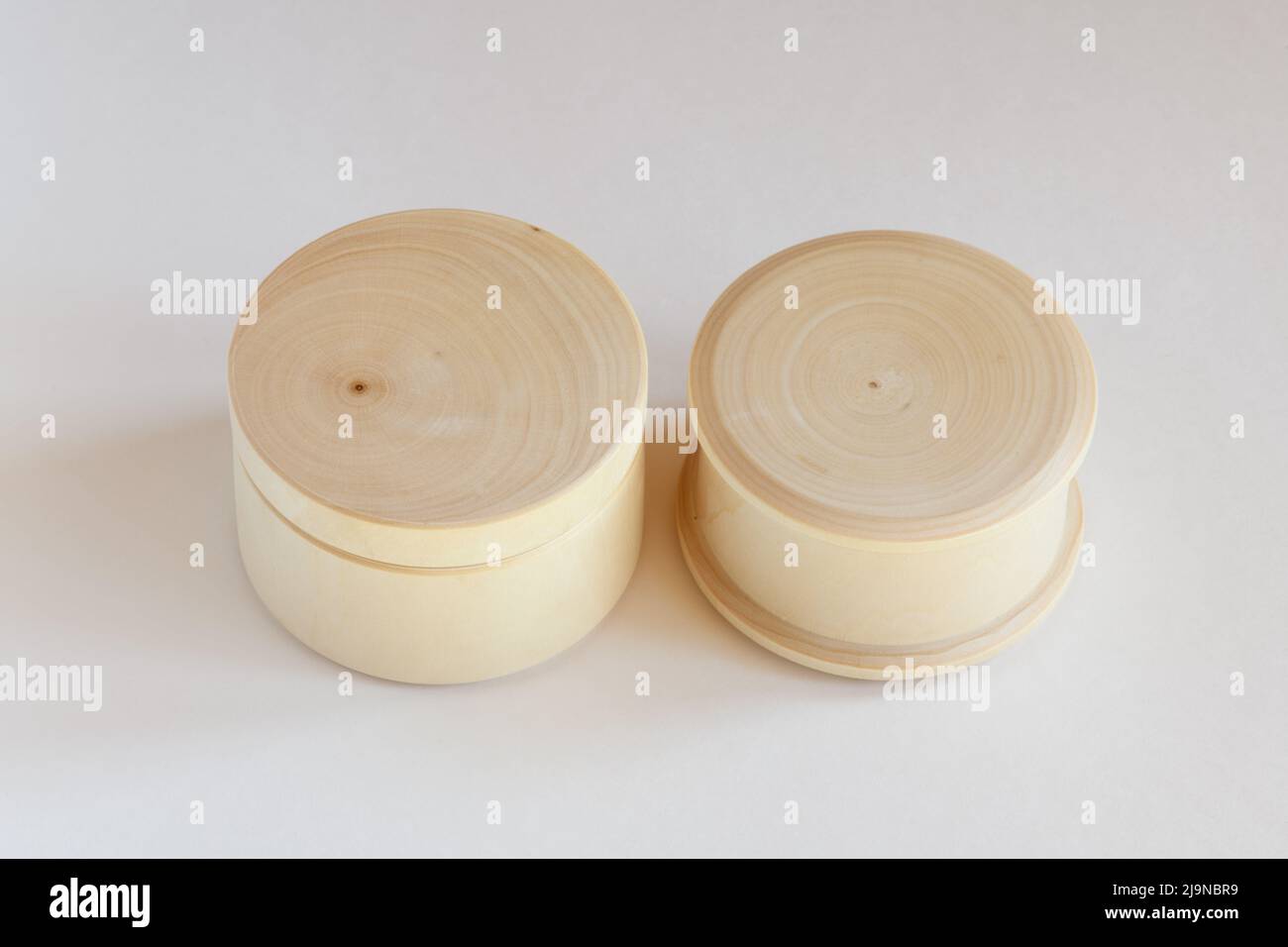 Two round wooden caskets mock up on white background Stock Photo - Alamy
