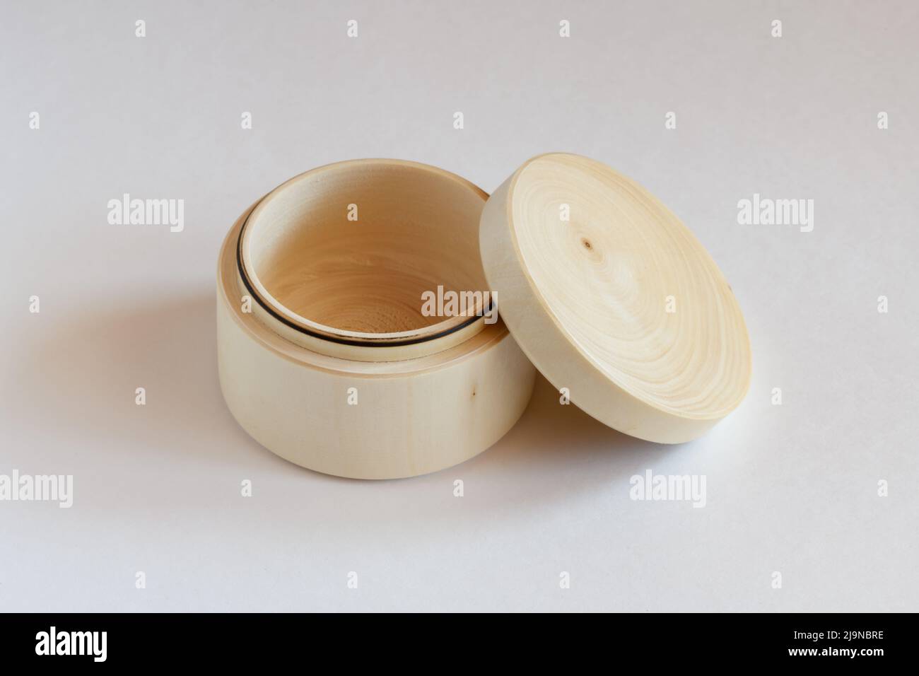 Round wooden casket mock up on white background Stock Photo - Alamy