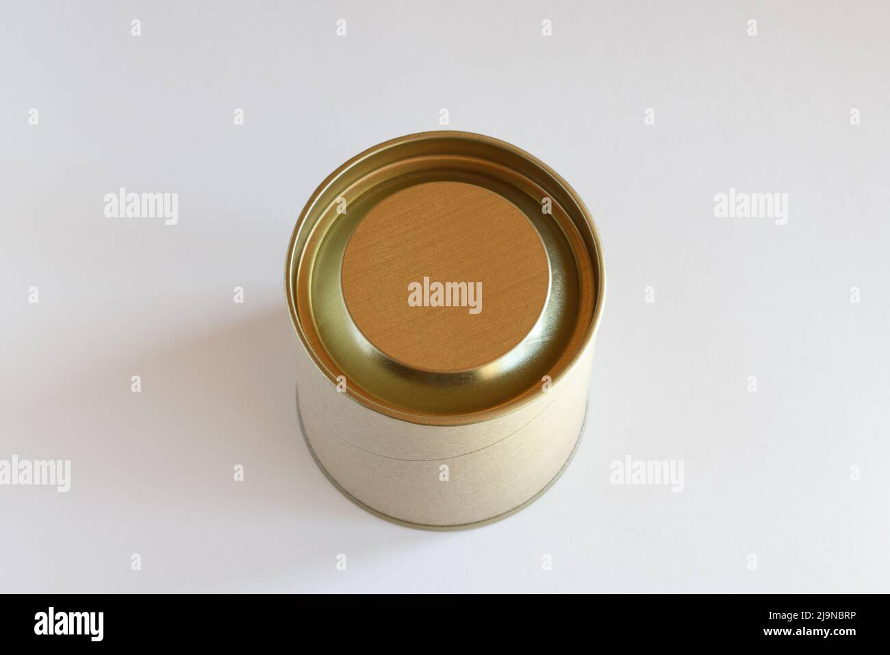 Short cardboard cylinder tube with metal lid on white background Stock ...