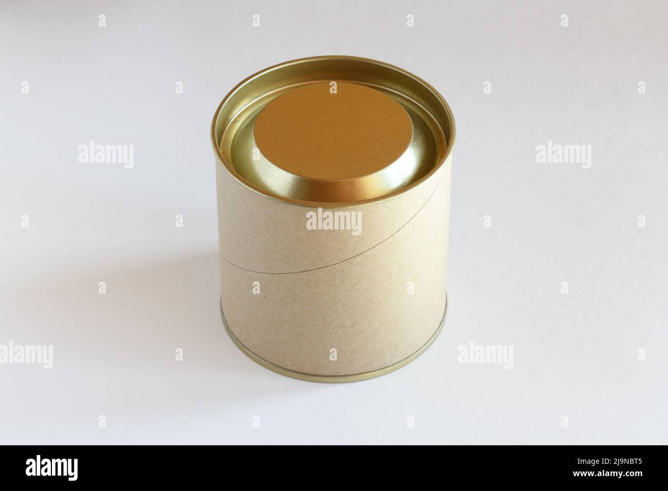 Short cardboard cylinder tube with metal lid on white background Stock ...