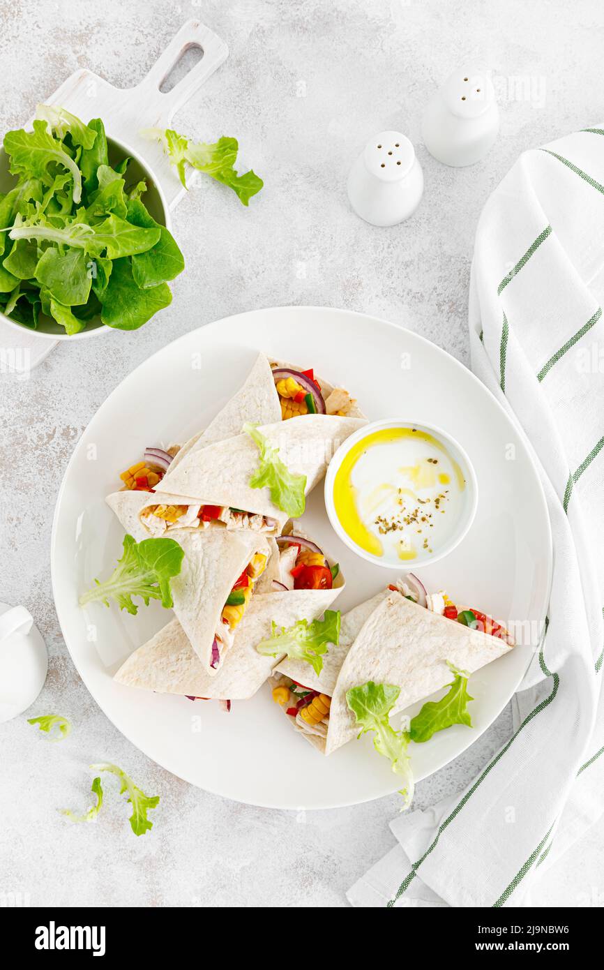 Greek chicken wraps souvlaki with vegetables and tzatziki sause. Top ...