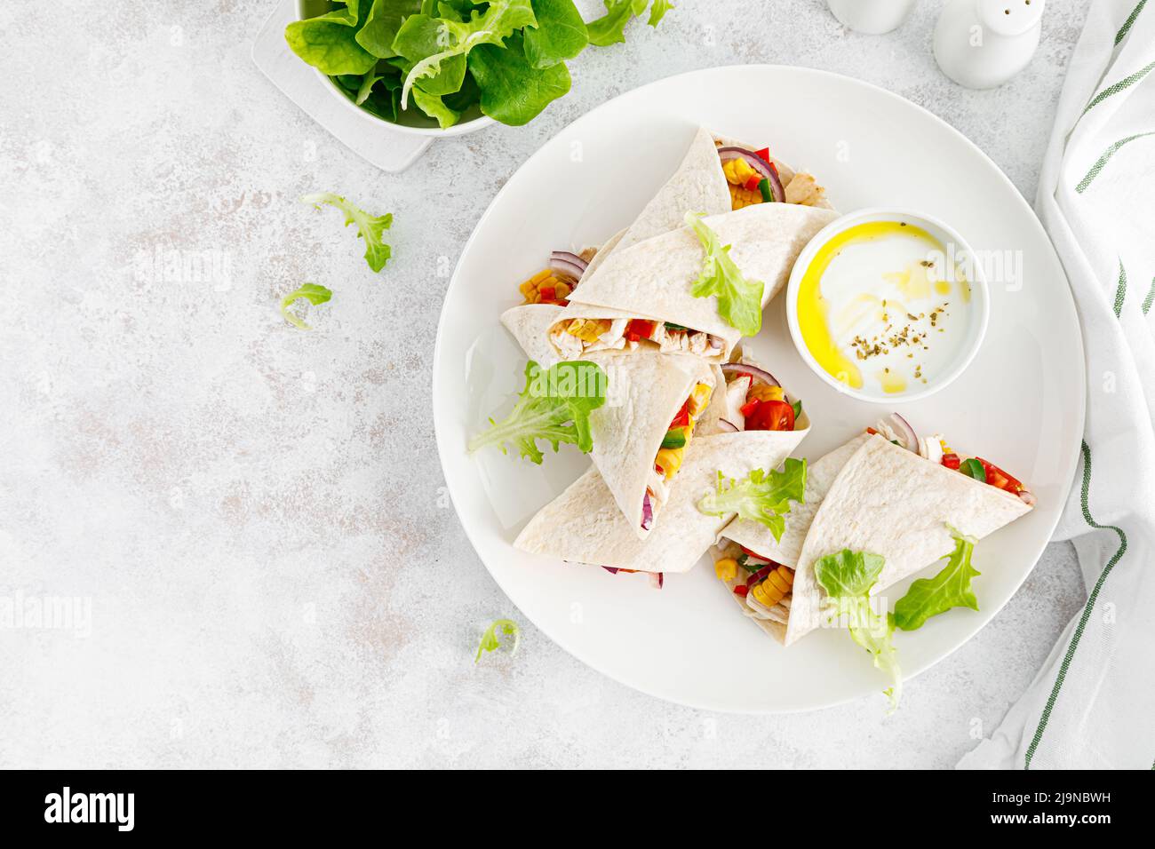 Greek chicken wraps souvlaki with vegetables and tzatziki sause. Top ...