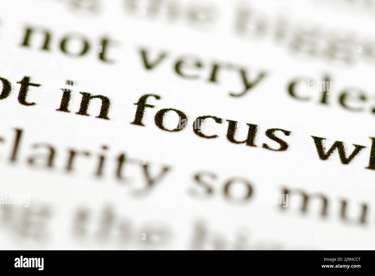 Close up of the typed words in focus printed in black ink on white ink ...