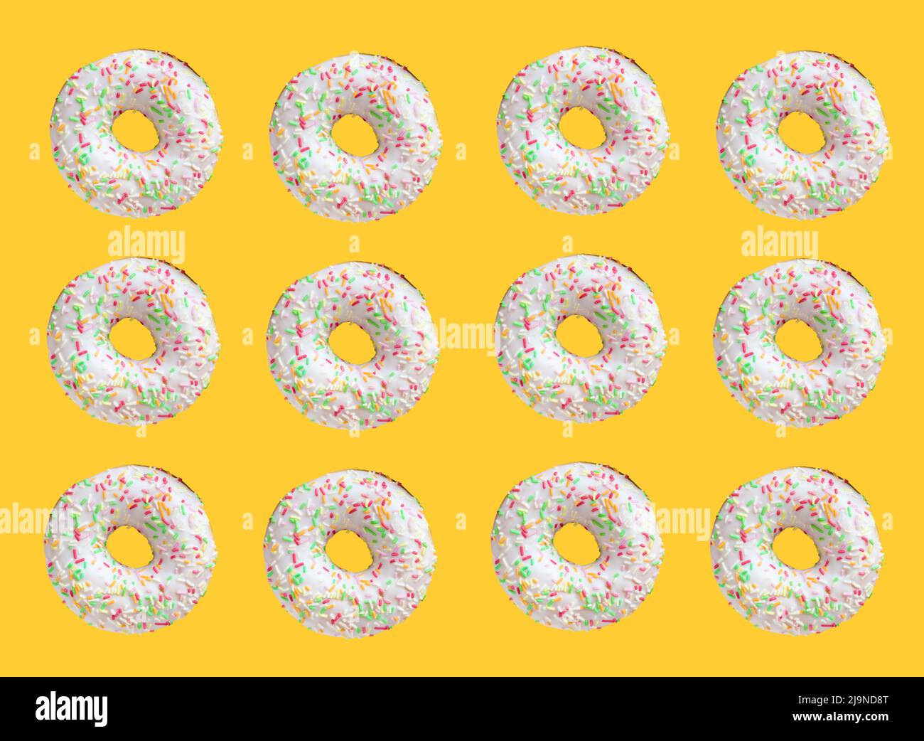 Pattern made of ring donuts with white glaze and clourful hundreds and ...